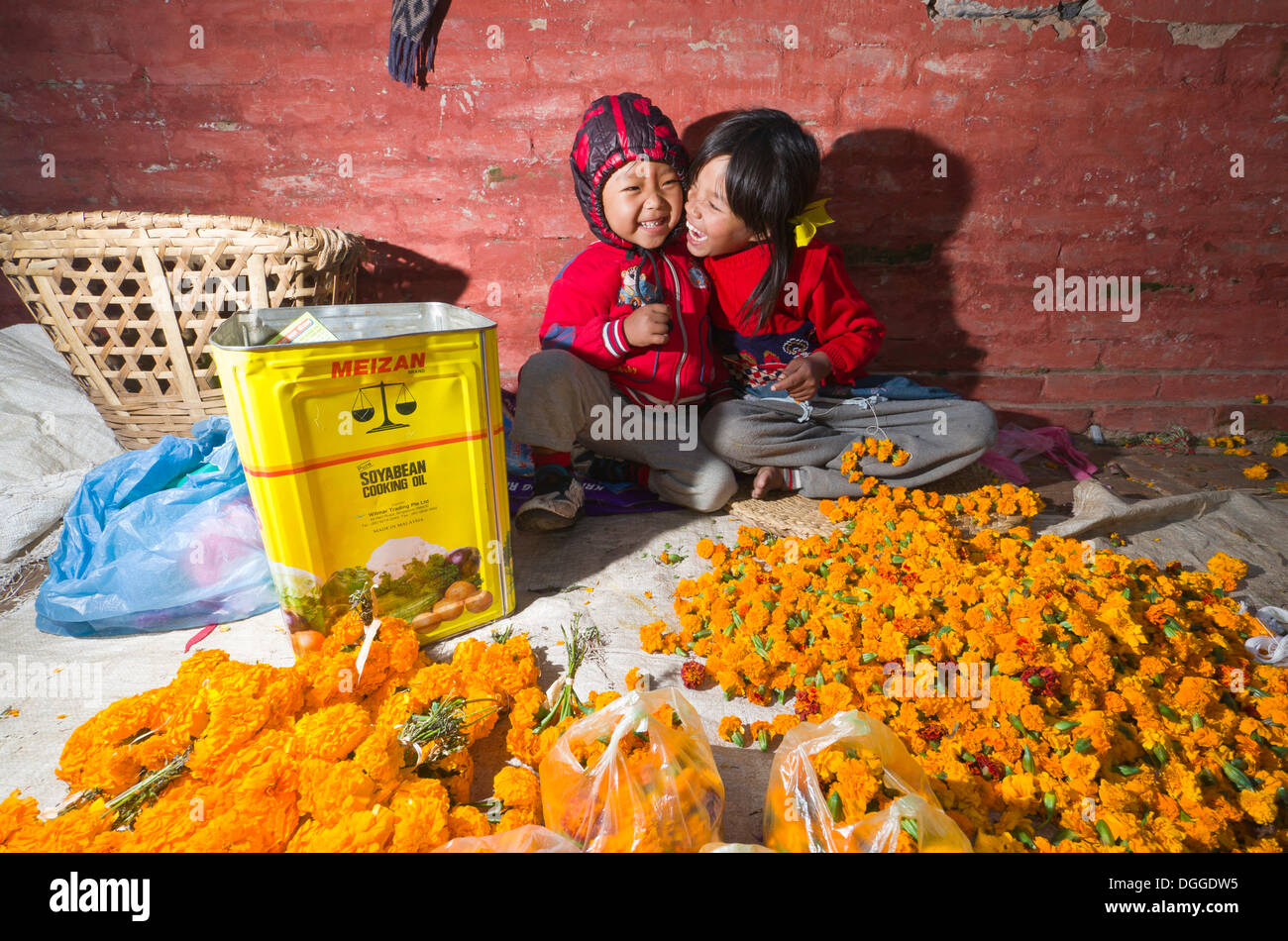 Child selling flowers hi-res stock photography and images - Alamy