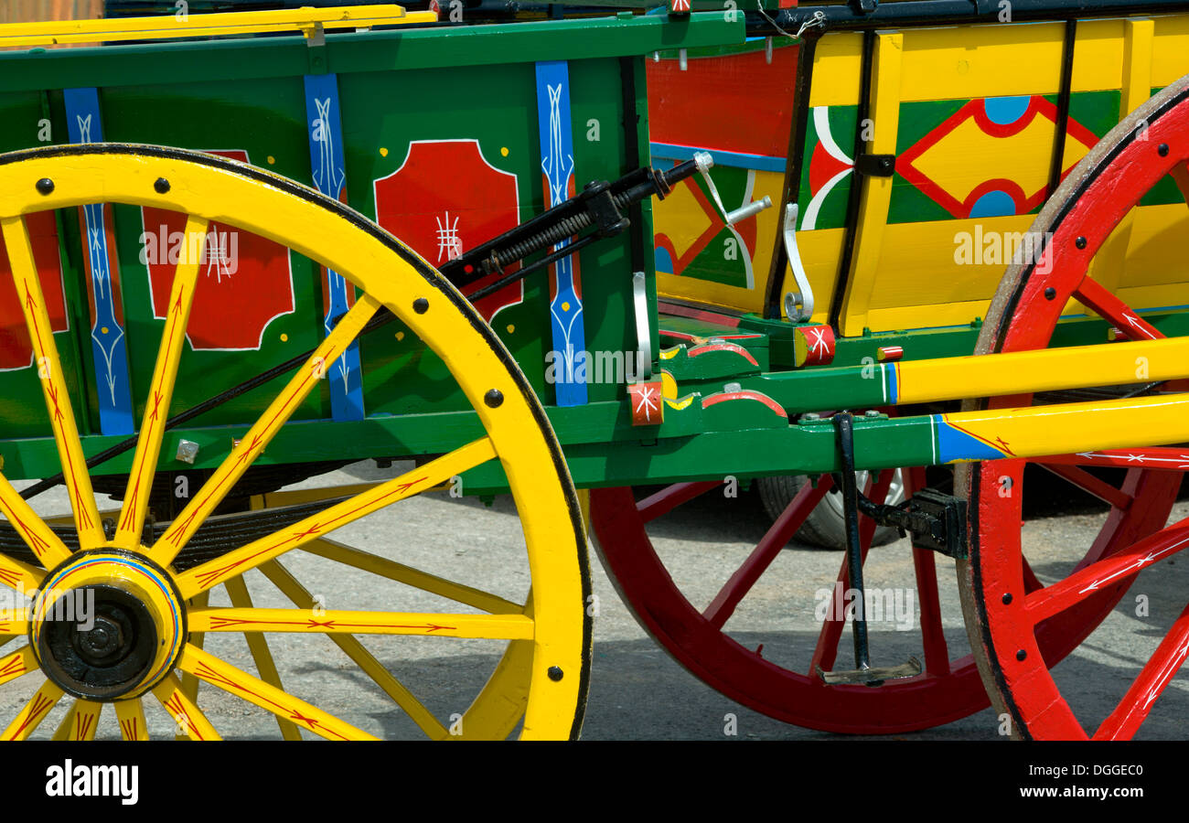 Portugal, the Algarve, brightly coloured traditional painted carts ...