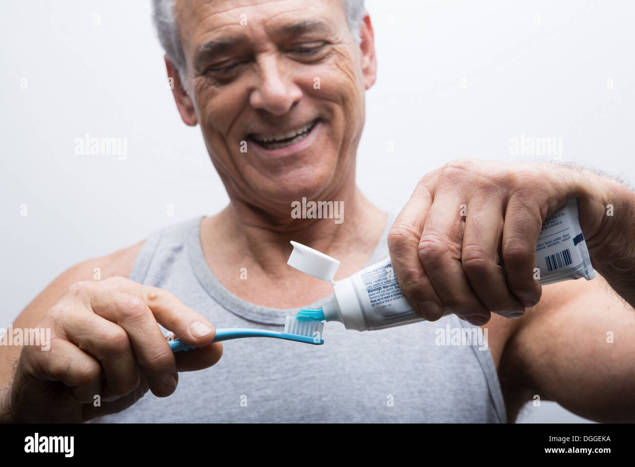 Squeezing toothpaste onto toothbrush hi-res stock photography and ...