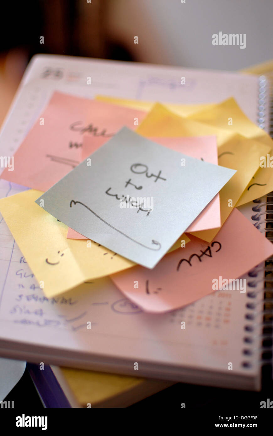 "Out to Lunch" note left on a mountain of Post Its Stock Photo - Alamy