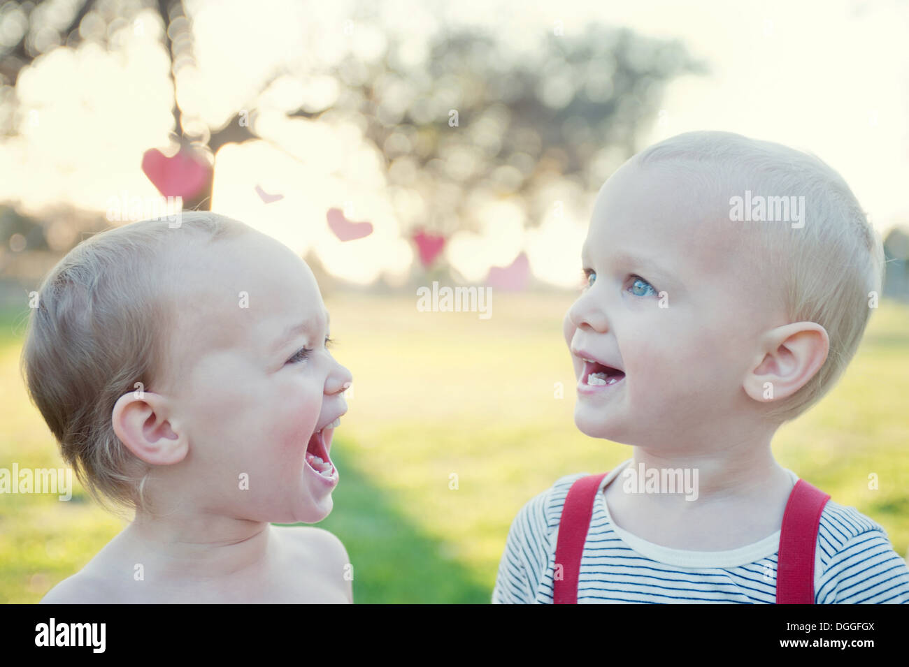 Brother and sister laughing outdoors Stock Photo - Alamy