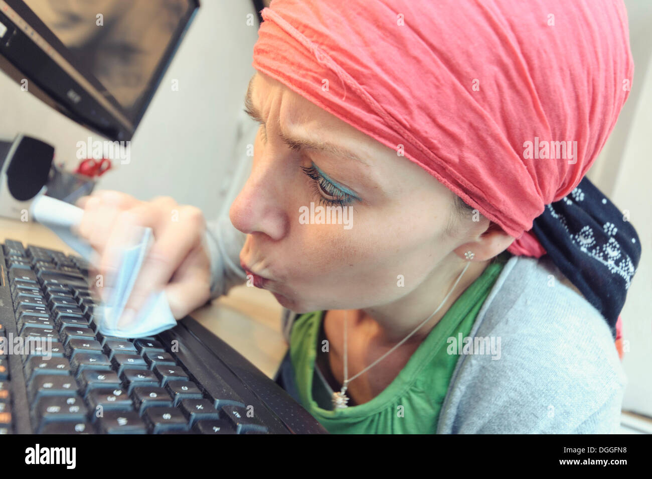 Cleaning lady cleaning a computer keyboard, Germany Stock Photo - Alamy