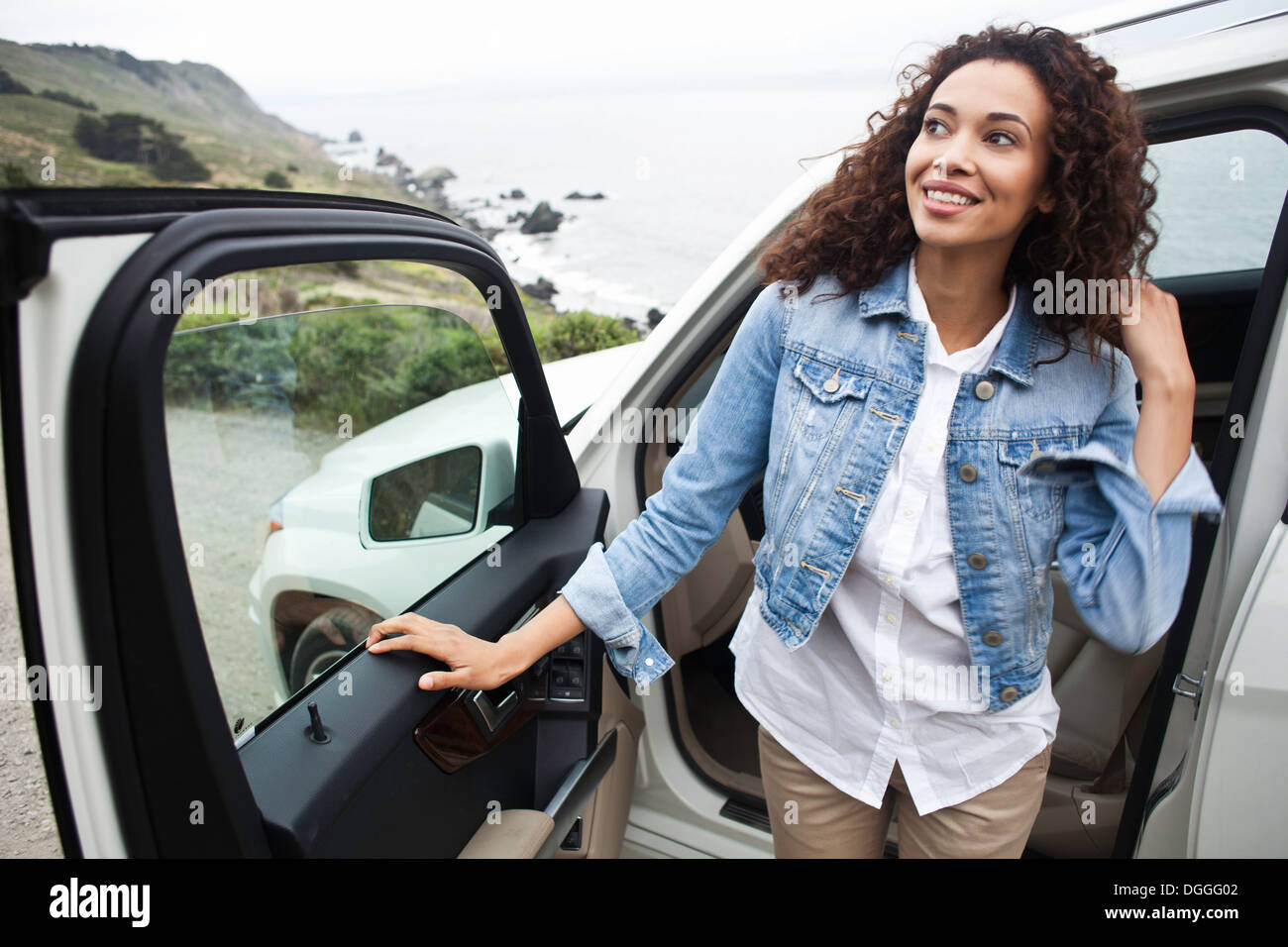 Woman getting out of car hi-res stock photography and images - Alamy