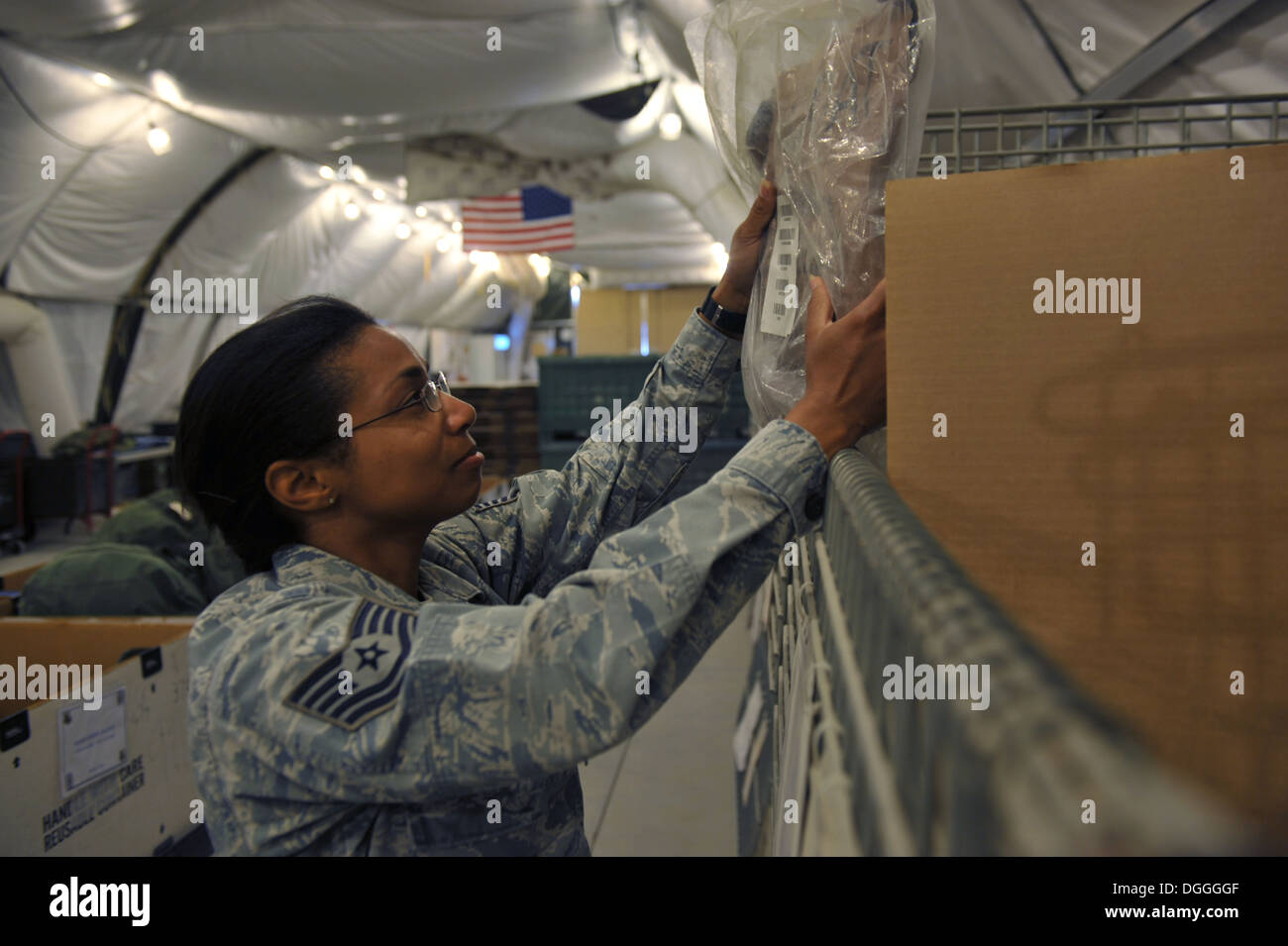 Tech. Sgt. Penelope Patterson checks the expiration date on a joint ...