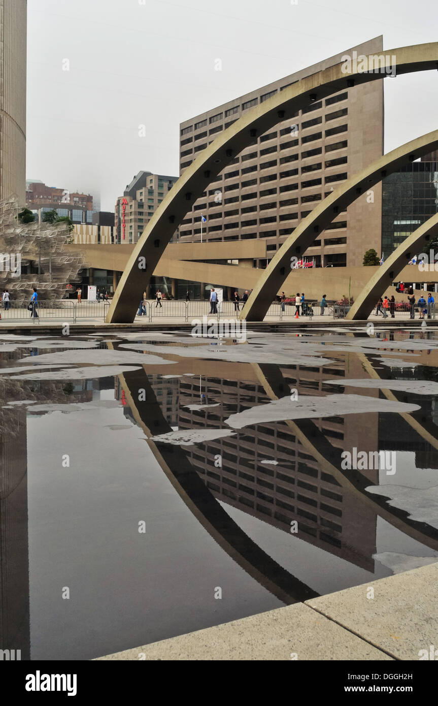 Reflection of the New City Hall in a puddle in the outdoor ice rink in ...