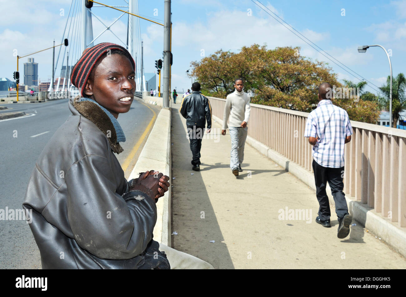 Street child begging on the Mandela Bridge, Johannesburg, South Africa ...