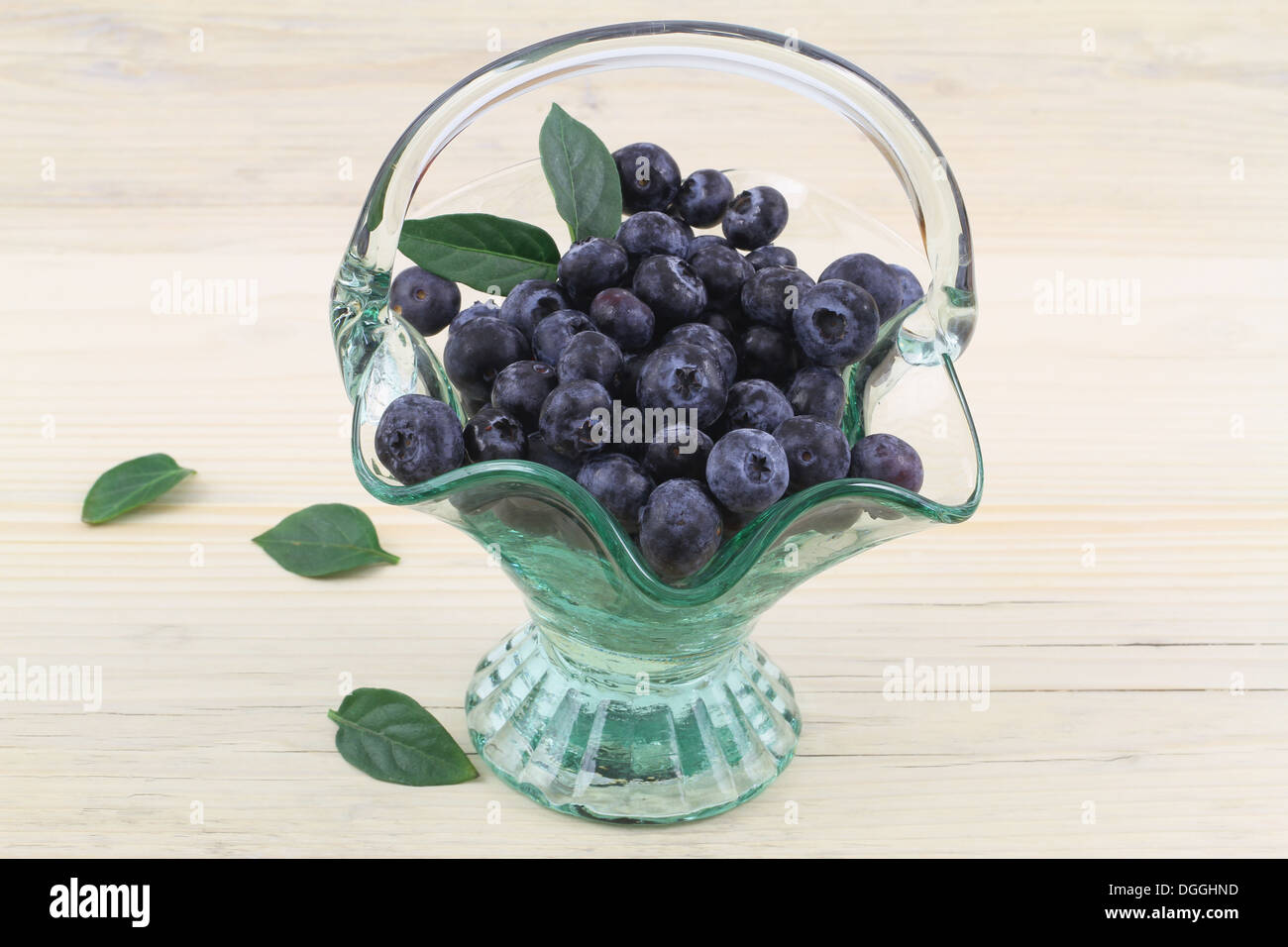 Blueberries in vintage glass basket Stock Photo - Alamy