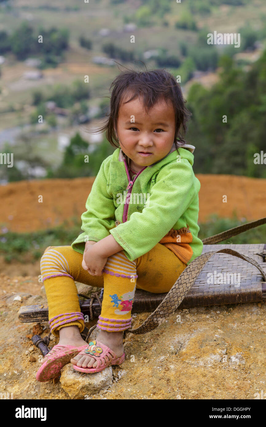 A young child on the mountain trail at Lao Chai village near Sapa ...