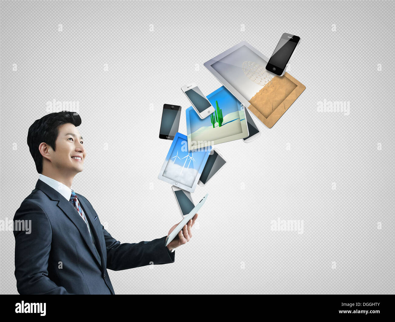 a business man with several devices Stock Photo - Alamy