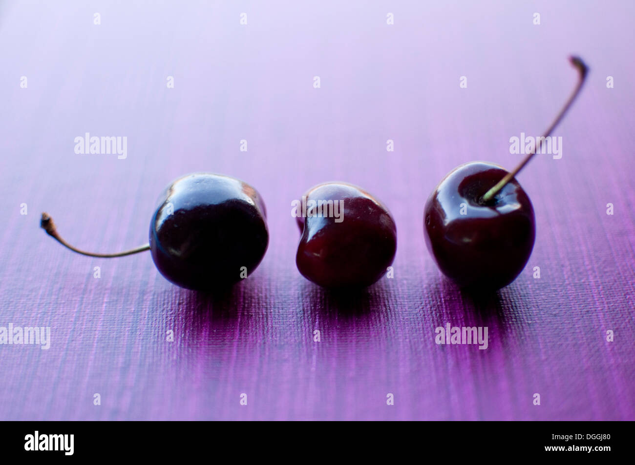 Still Food: Three Cherries Stock Photo - Alamy