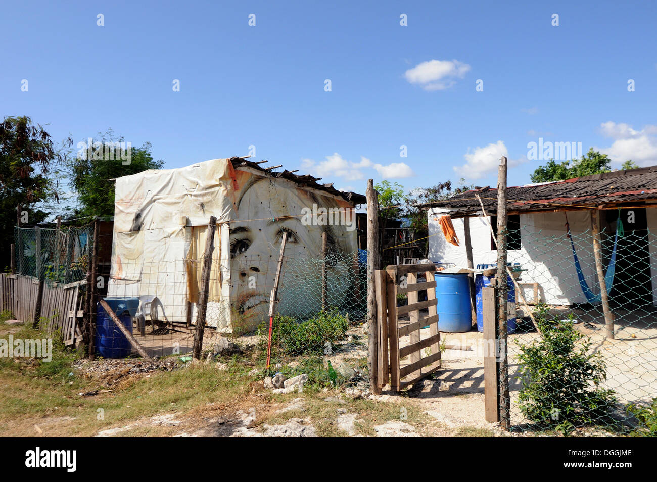 Billboard with the face of a female model serves as an outer wall of a ...