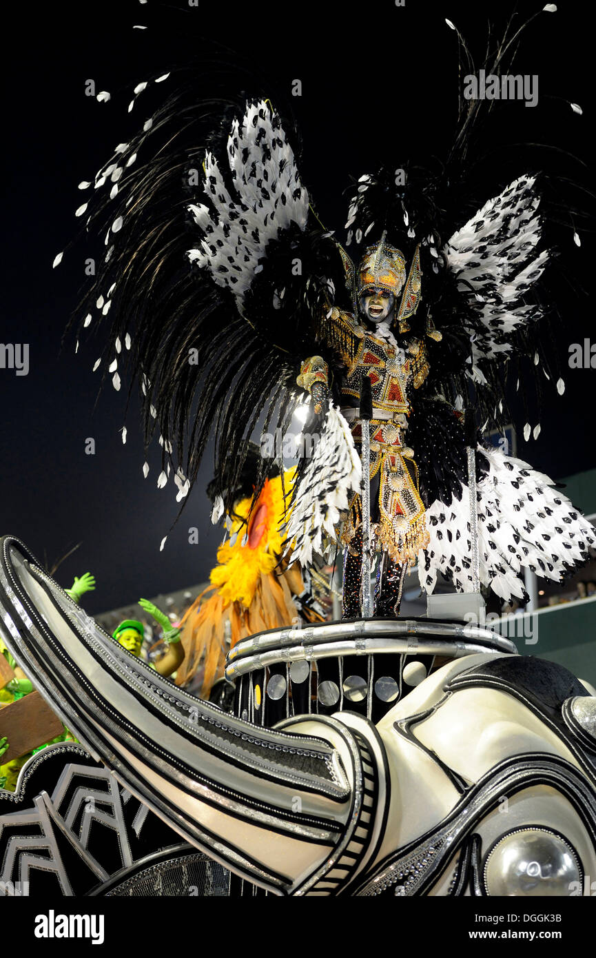 Samba dancer on an allegorical float, adorned with black and white ...