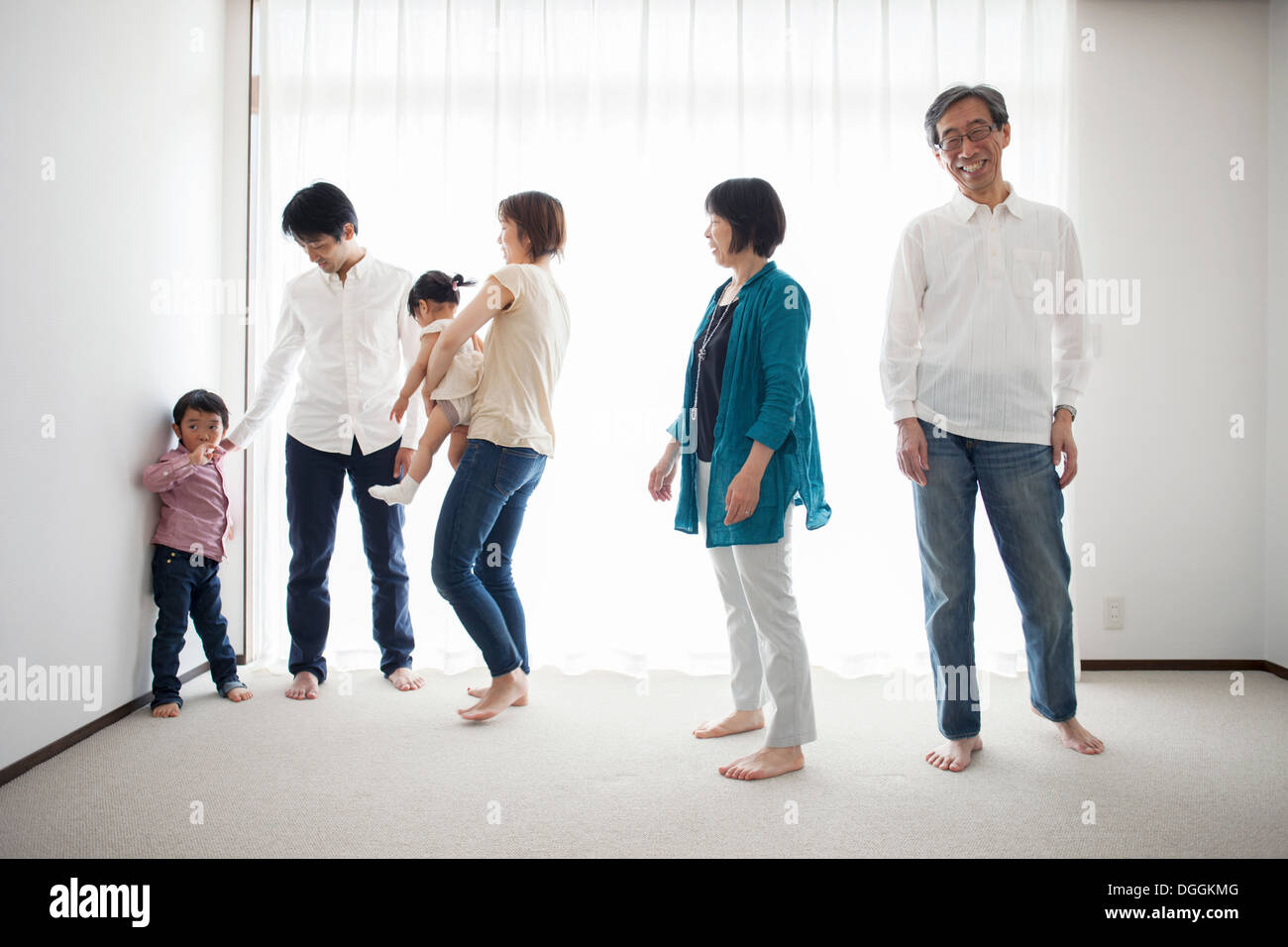 Three generation family by window Stock Photo - Alamy