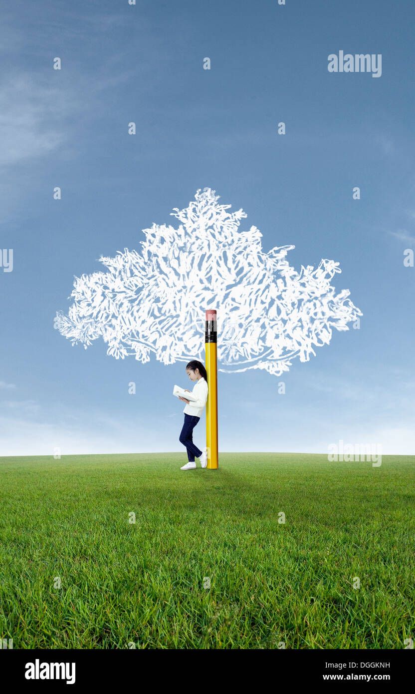 a girl leaning on a tree made out of a pencil Stock Photo - Alamy