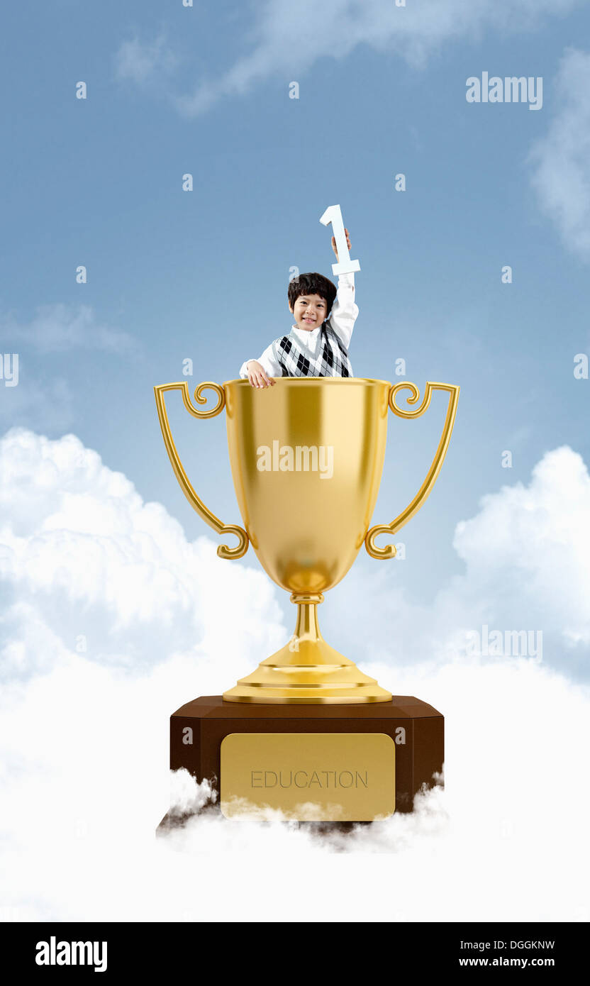 a boy inside a trophy Stock Photo - Alamy