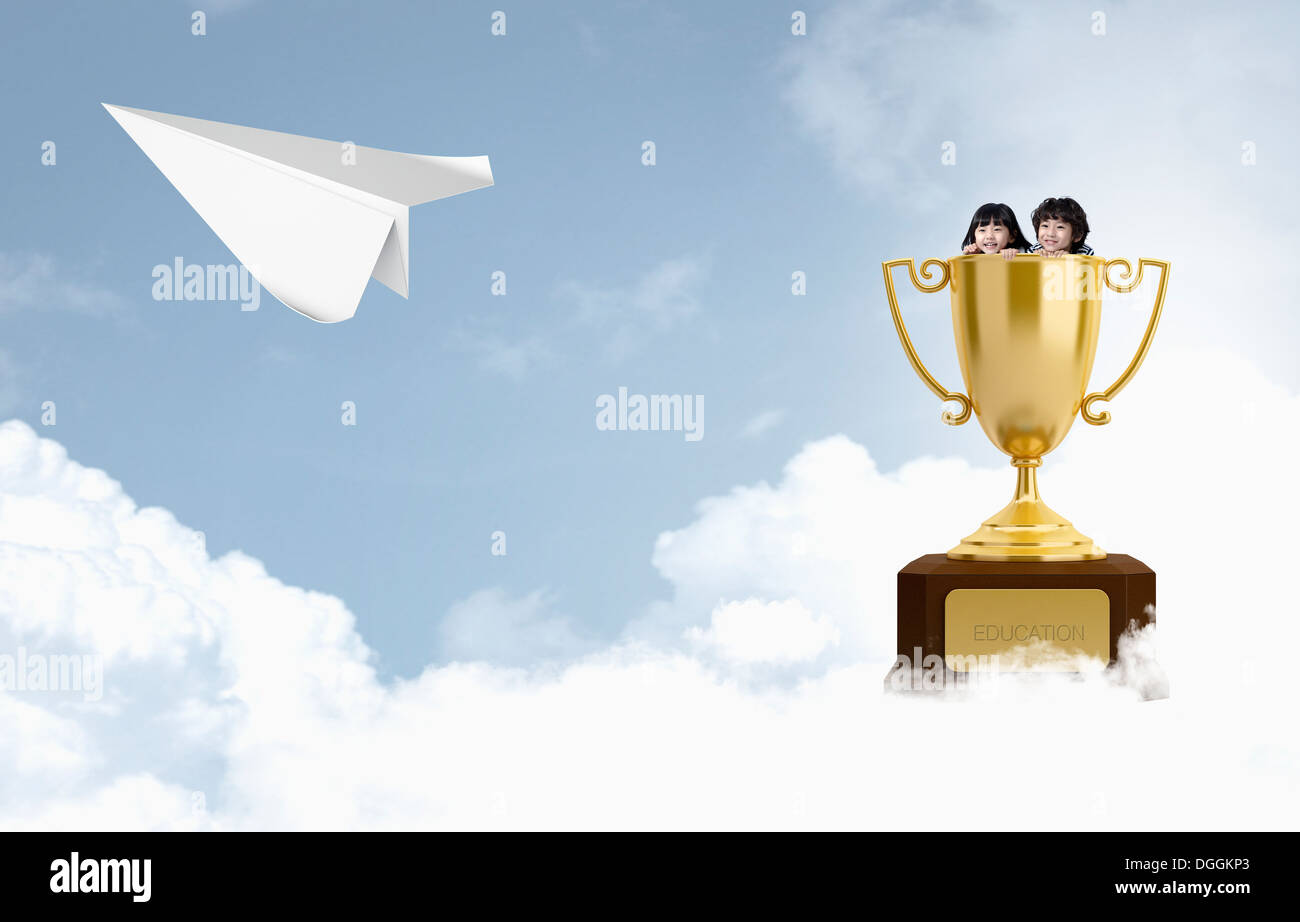 kids inside a trophy Stock Photo - Alamy