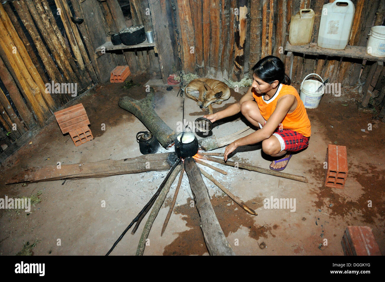 Woman cooking over open fire hi-res stock photography and images - Alamy