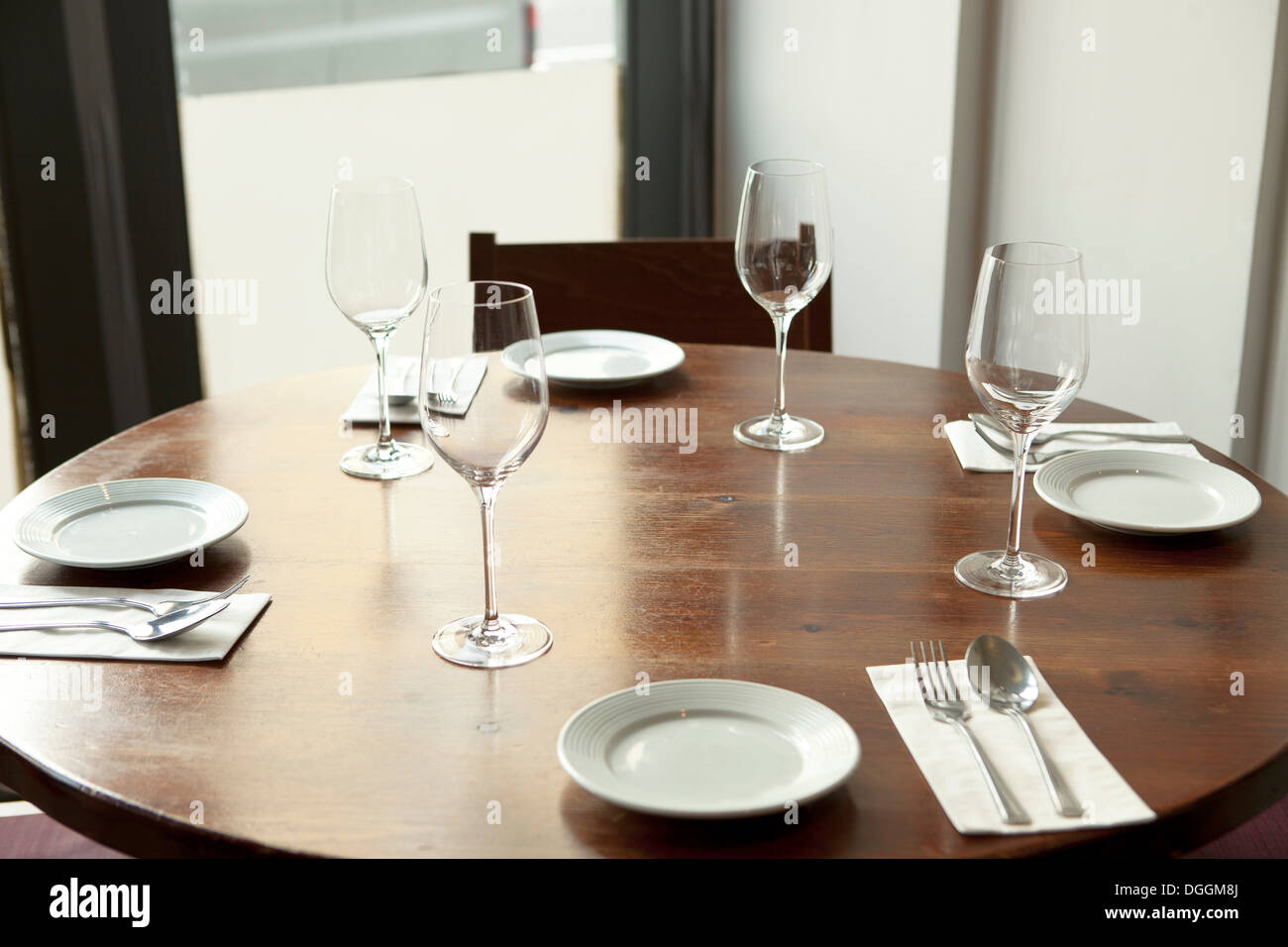 Table setting in restaurant Stock Photo - Alamy