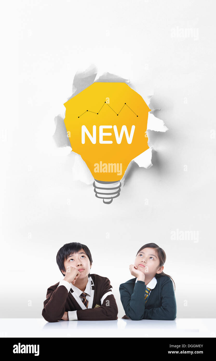 kids thinking with a light bulb Stock Photo - Alamy