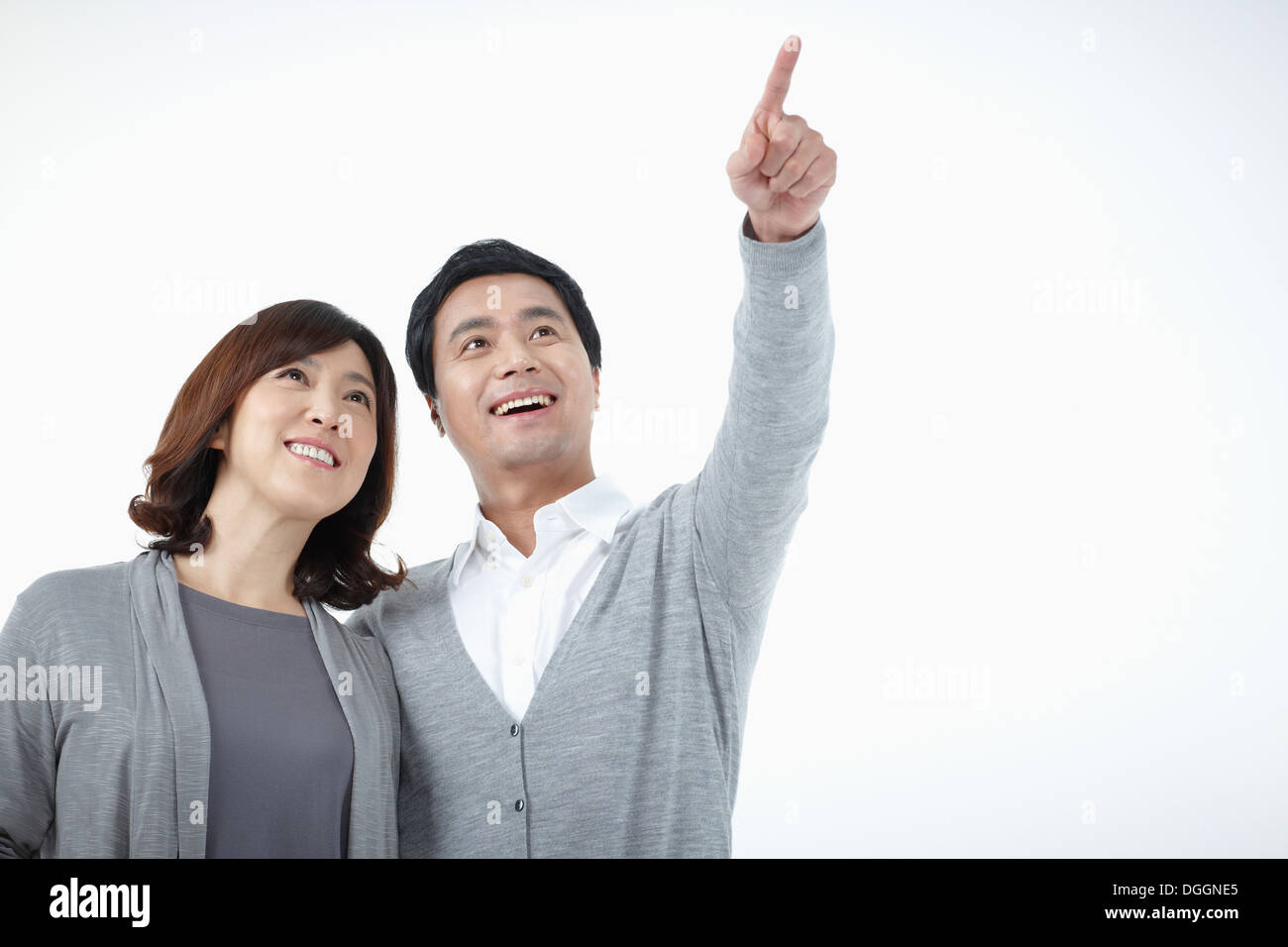 Woman pointing at husband hi-res stock photography and images - Alamy