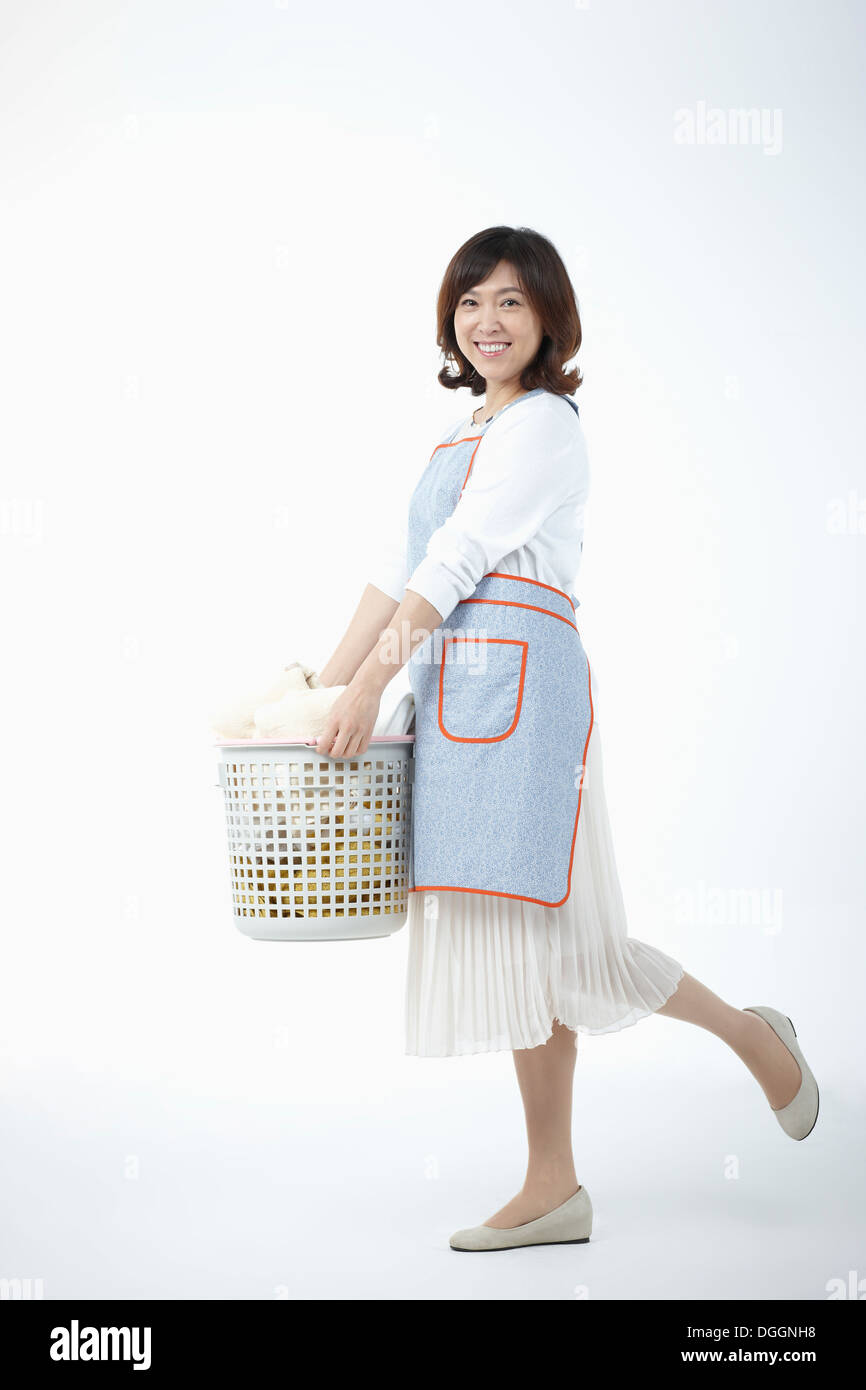 a woman ready to do laundry Stock Photo - Alamy