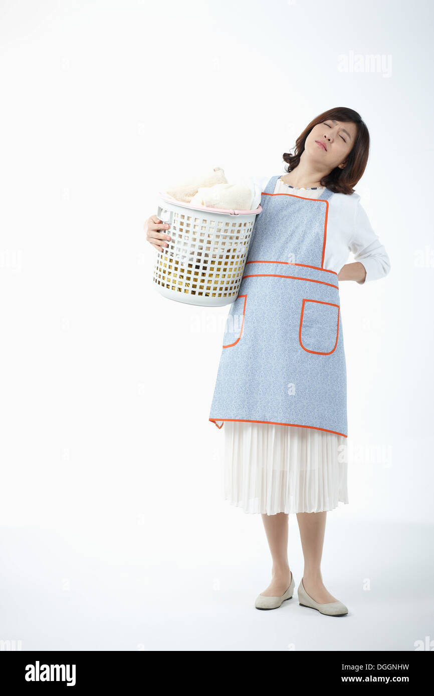 a woman ready to do laundry Stock Photo - Alamy