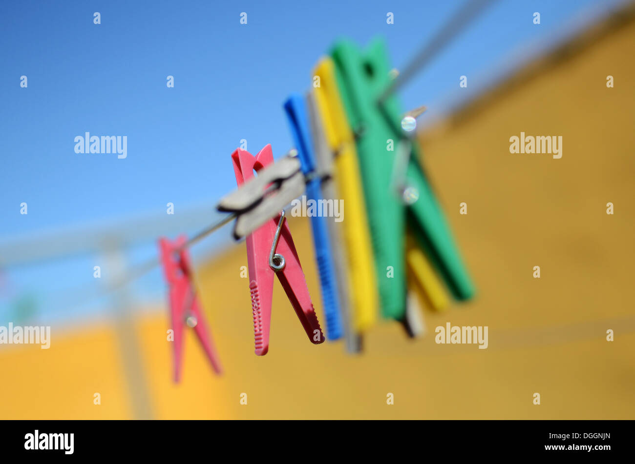 Assorted colored clothes pegs Stock Photo - Alamy
