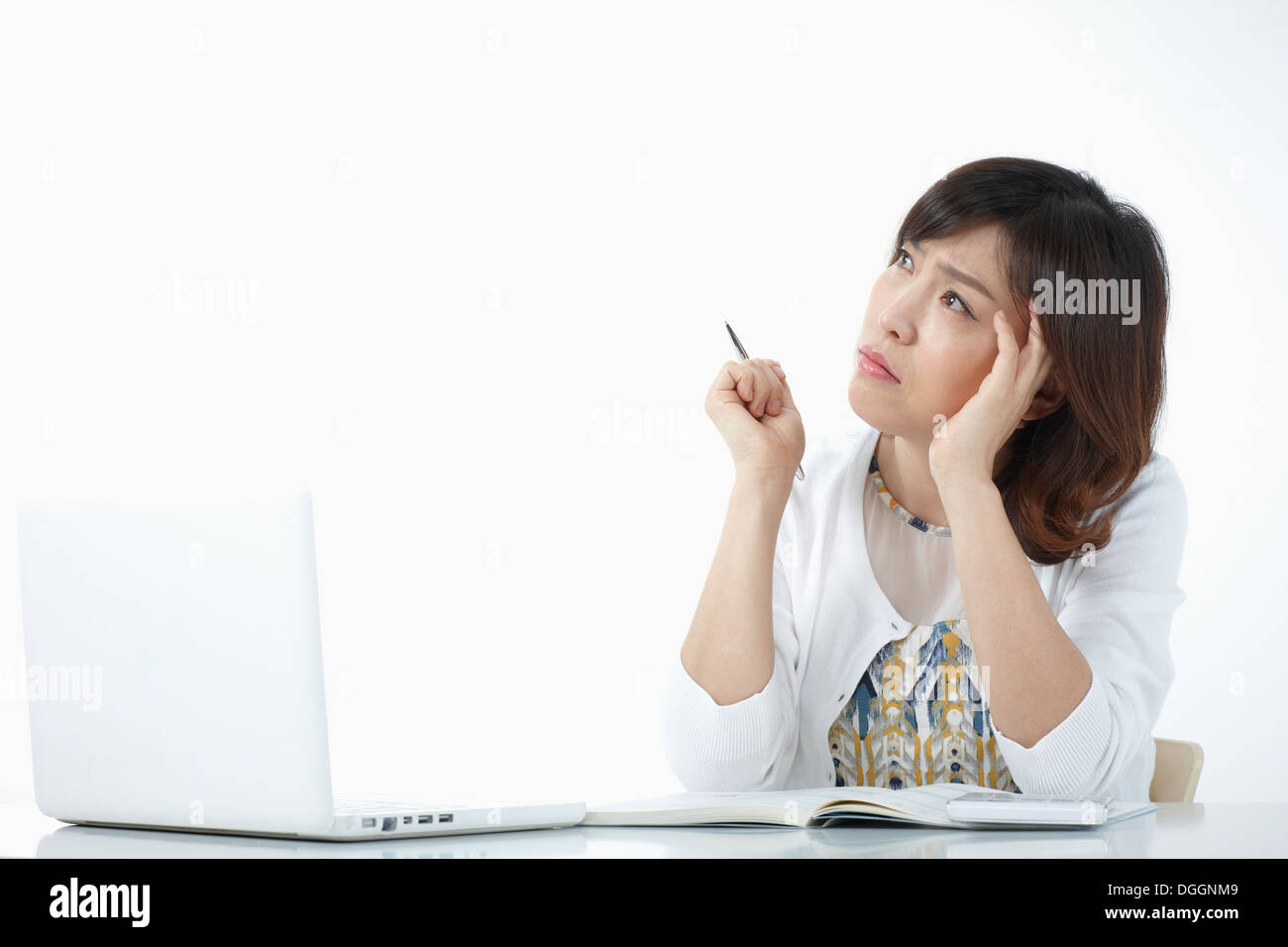 a woman thinking and writing Stock Photo - Alamy