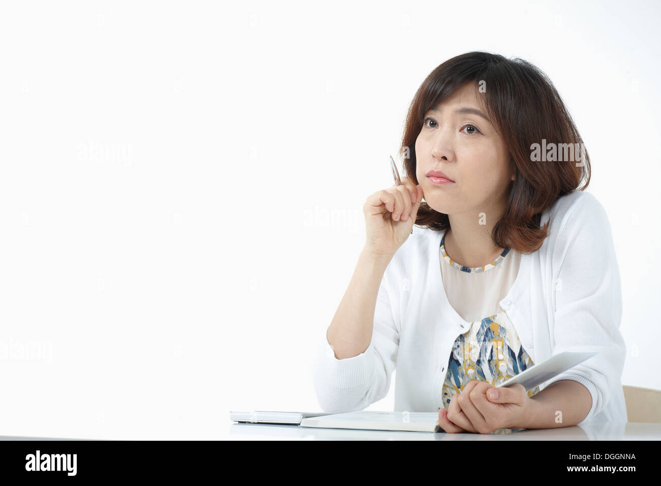 a woman thinking and writing Stock Photo - Alamy