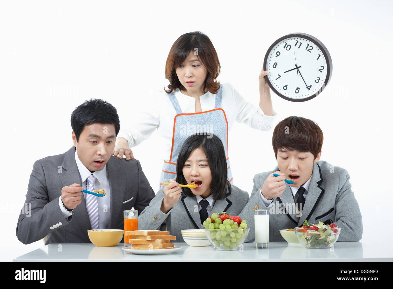a family running out of time to eat their meal Stock Photo - Alamy
