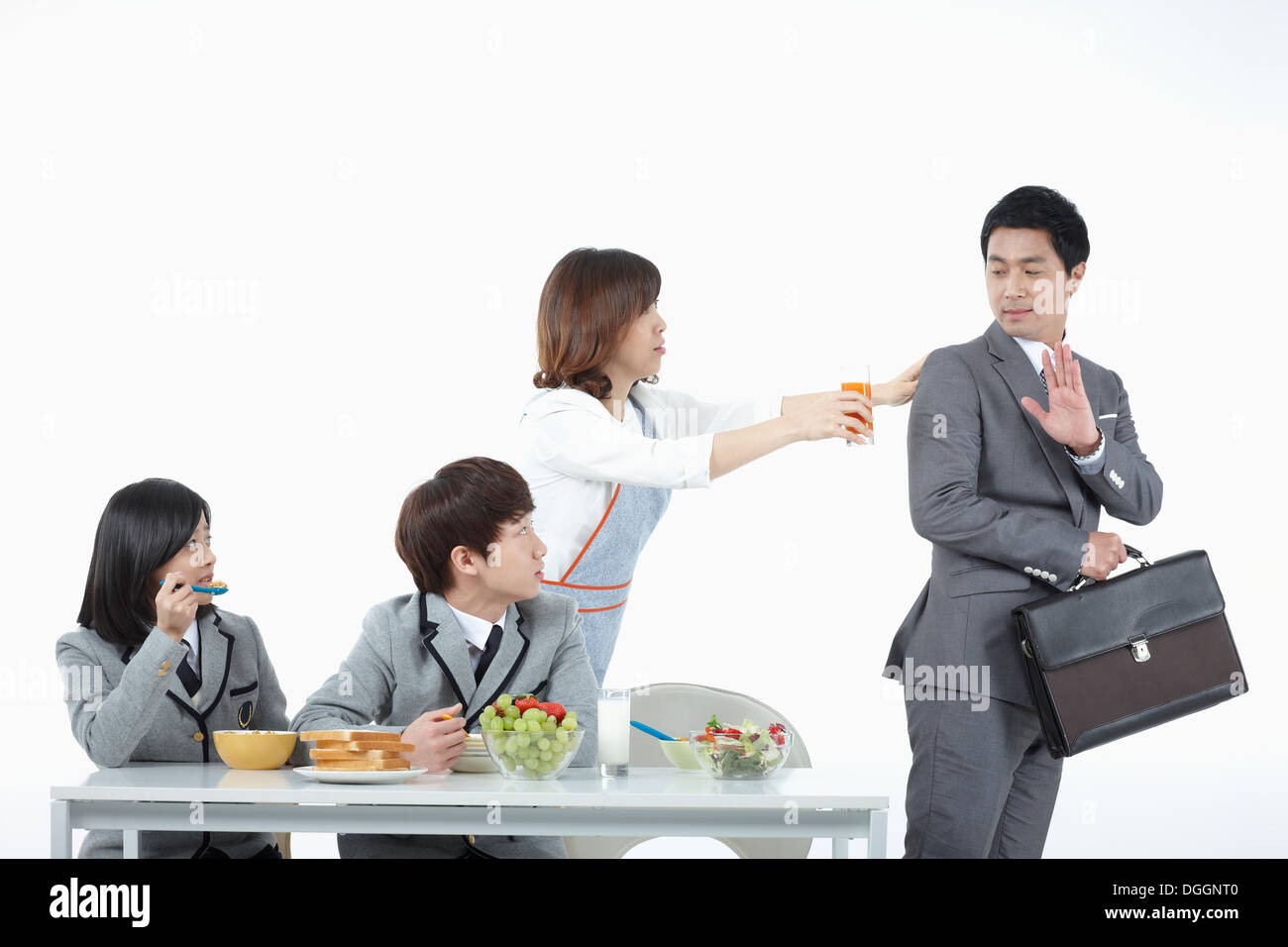 a family running out of time to eat their meal Stock Photo - Alamy