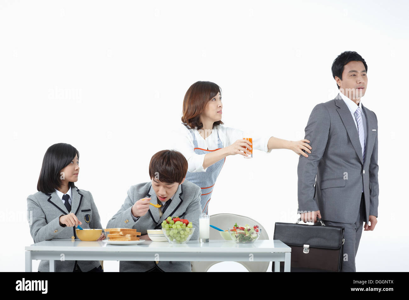 a family running out of time to eat their meal Stock Photo - Alamy