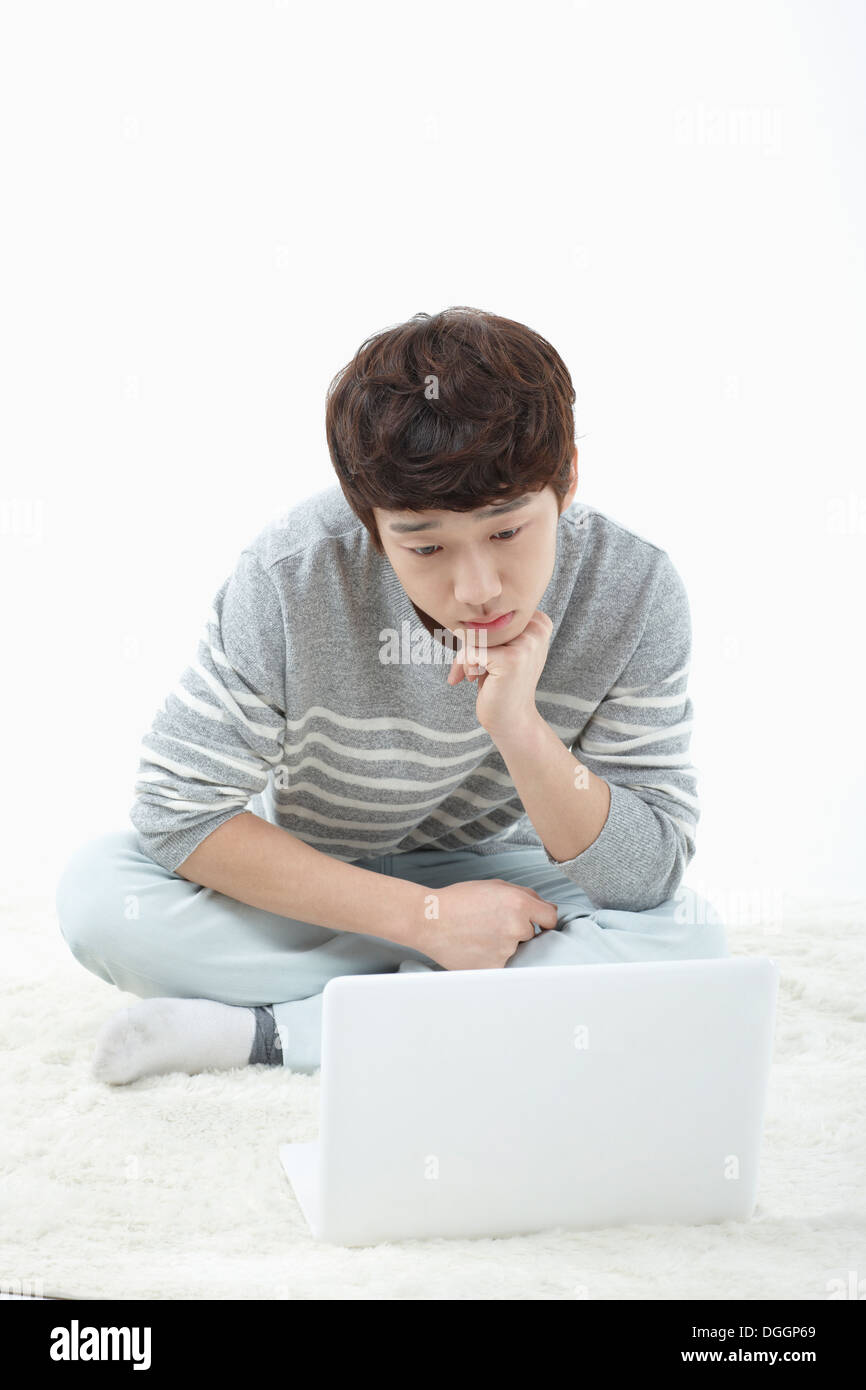 Boy sitting down hi-res stock photography and images - Alamy