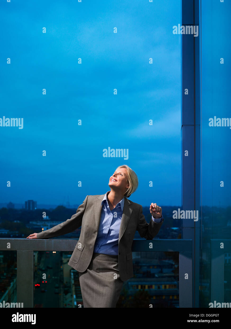 Smart lady in corporate environment overlooking the city Stock Photo ...