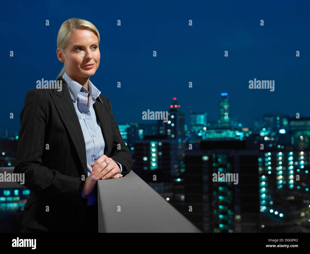 Smart lady in corporate environment overlooking the city Stock Photo ...