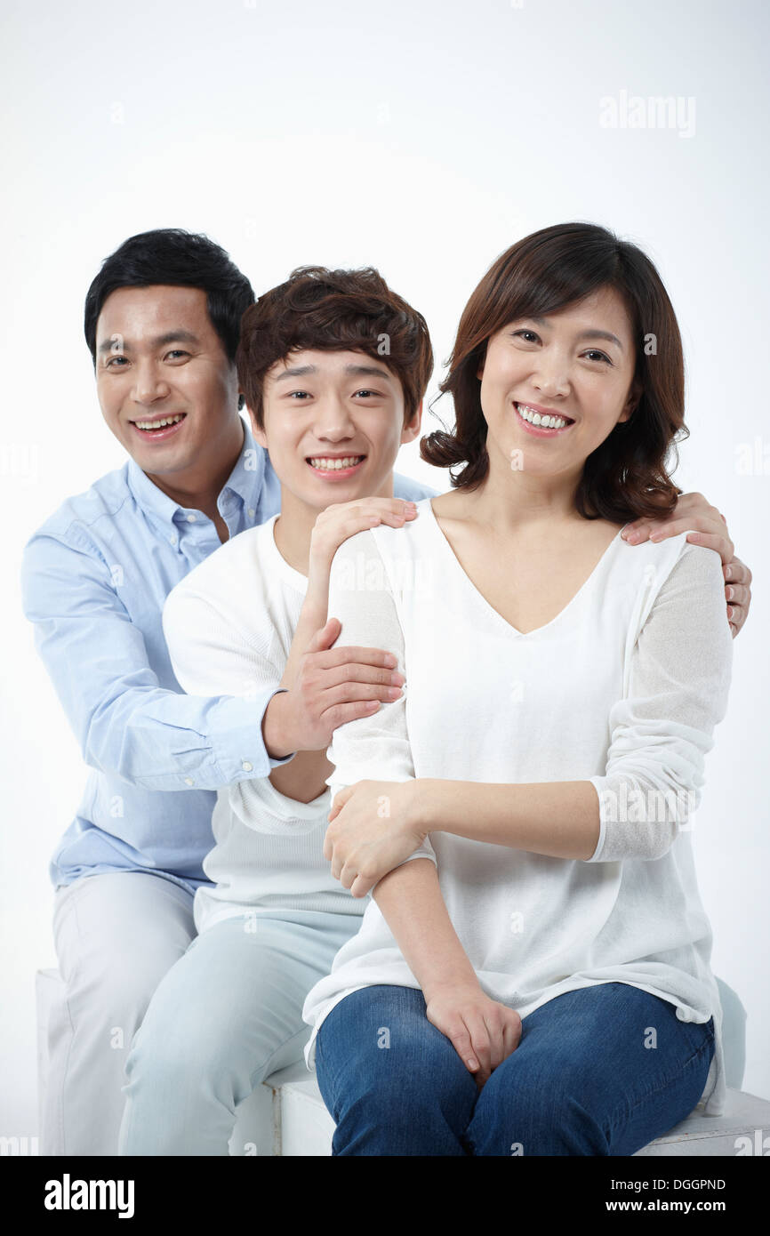 Boy sitting between parents hi-res stock photography and images - Alamy