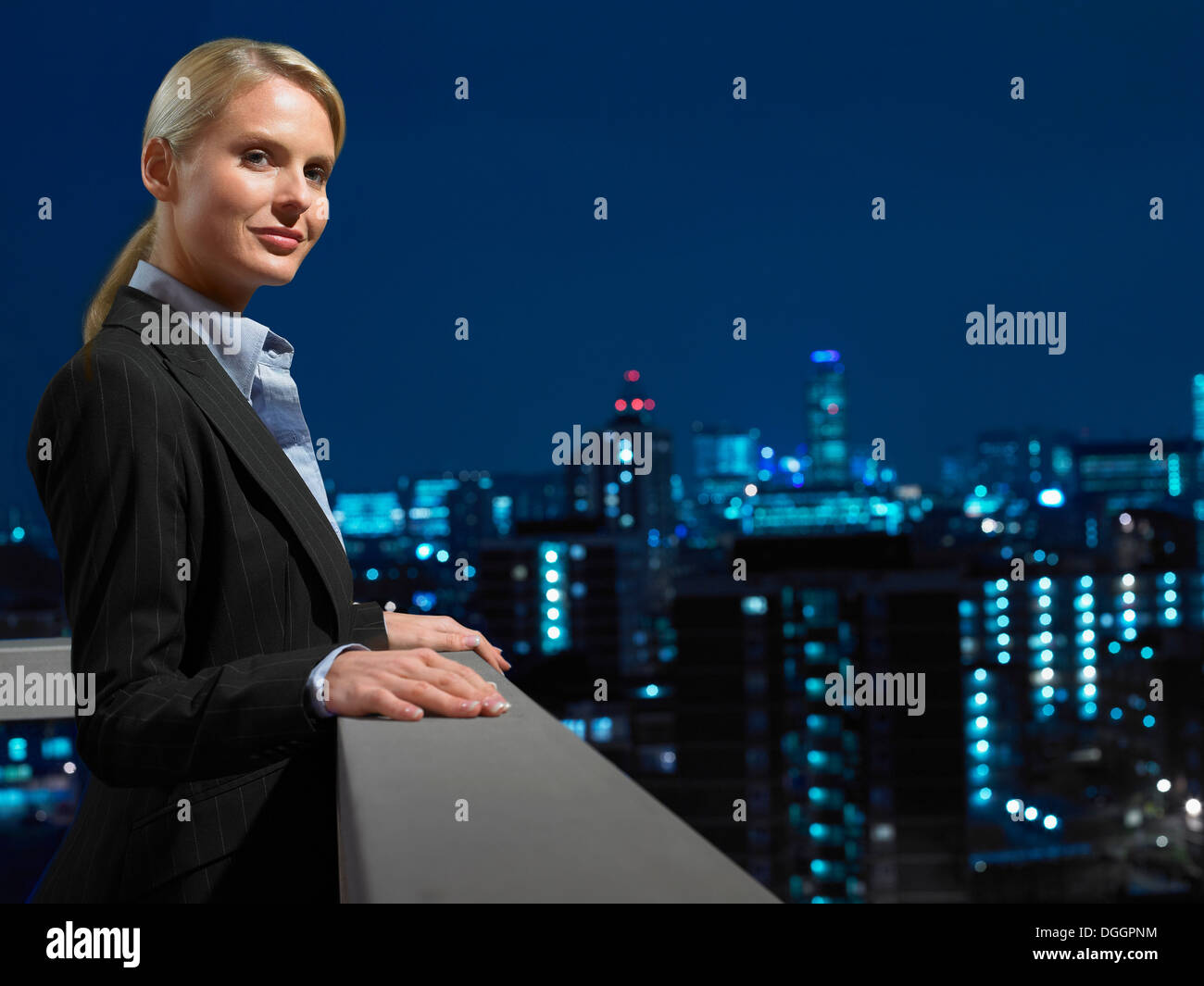 Smart lady in corporate environment overlooking the city Stock Photo ...
