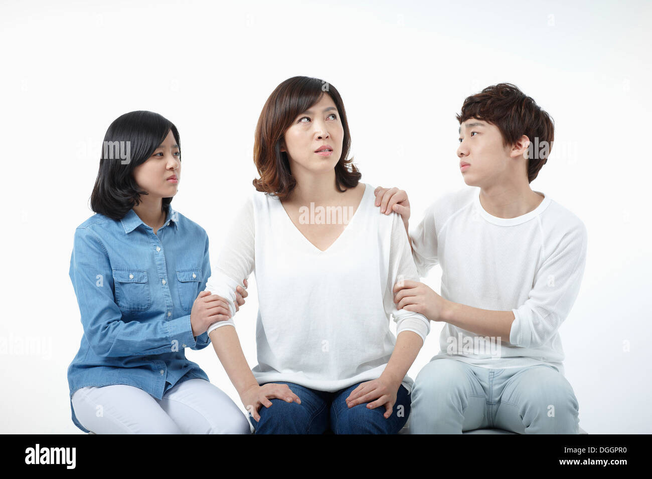 kids nagging to their mother Stock Photo - Alamy
