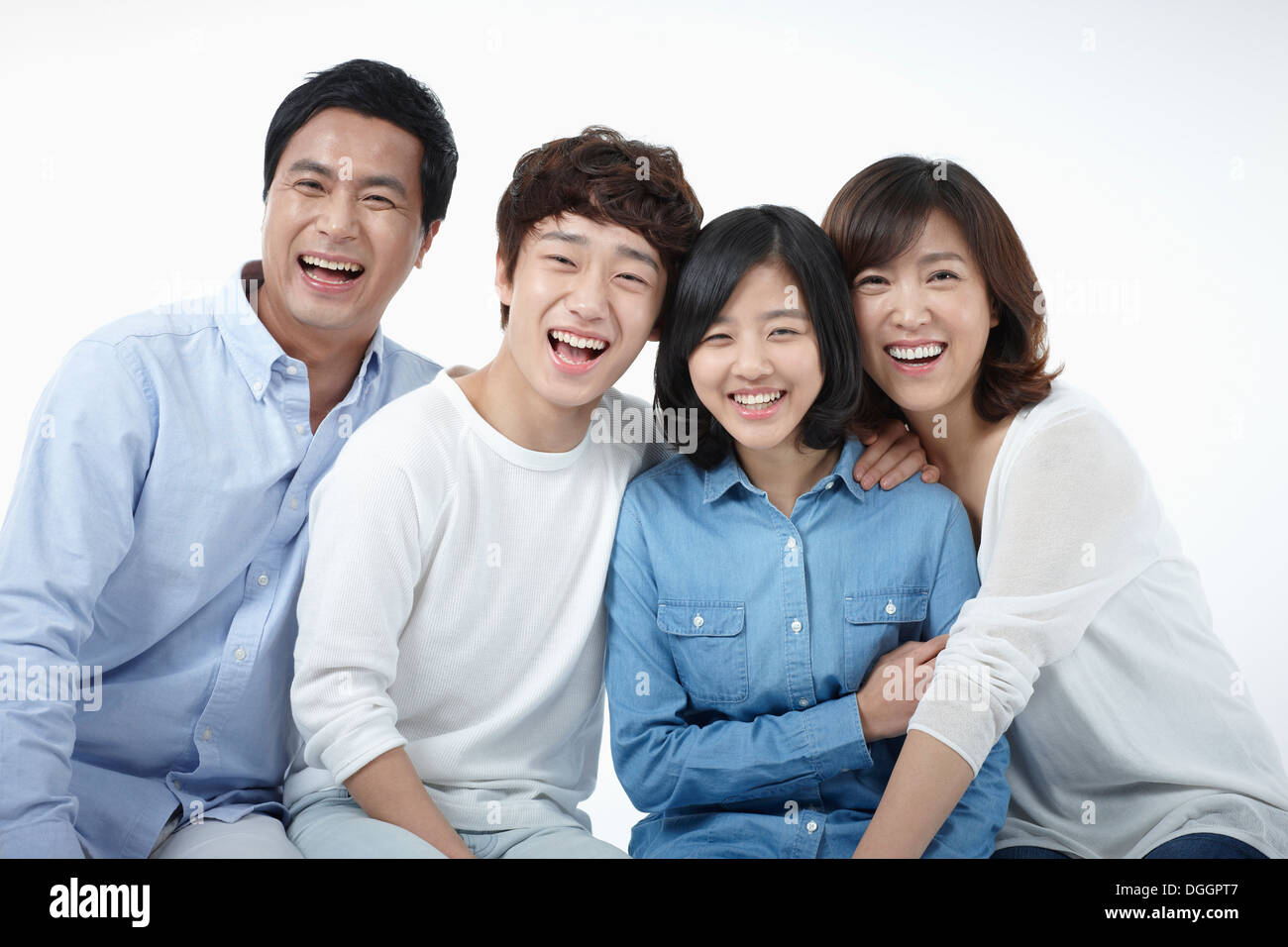 family sitting together Stock Photo - Alamy