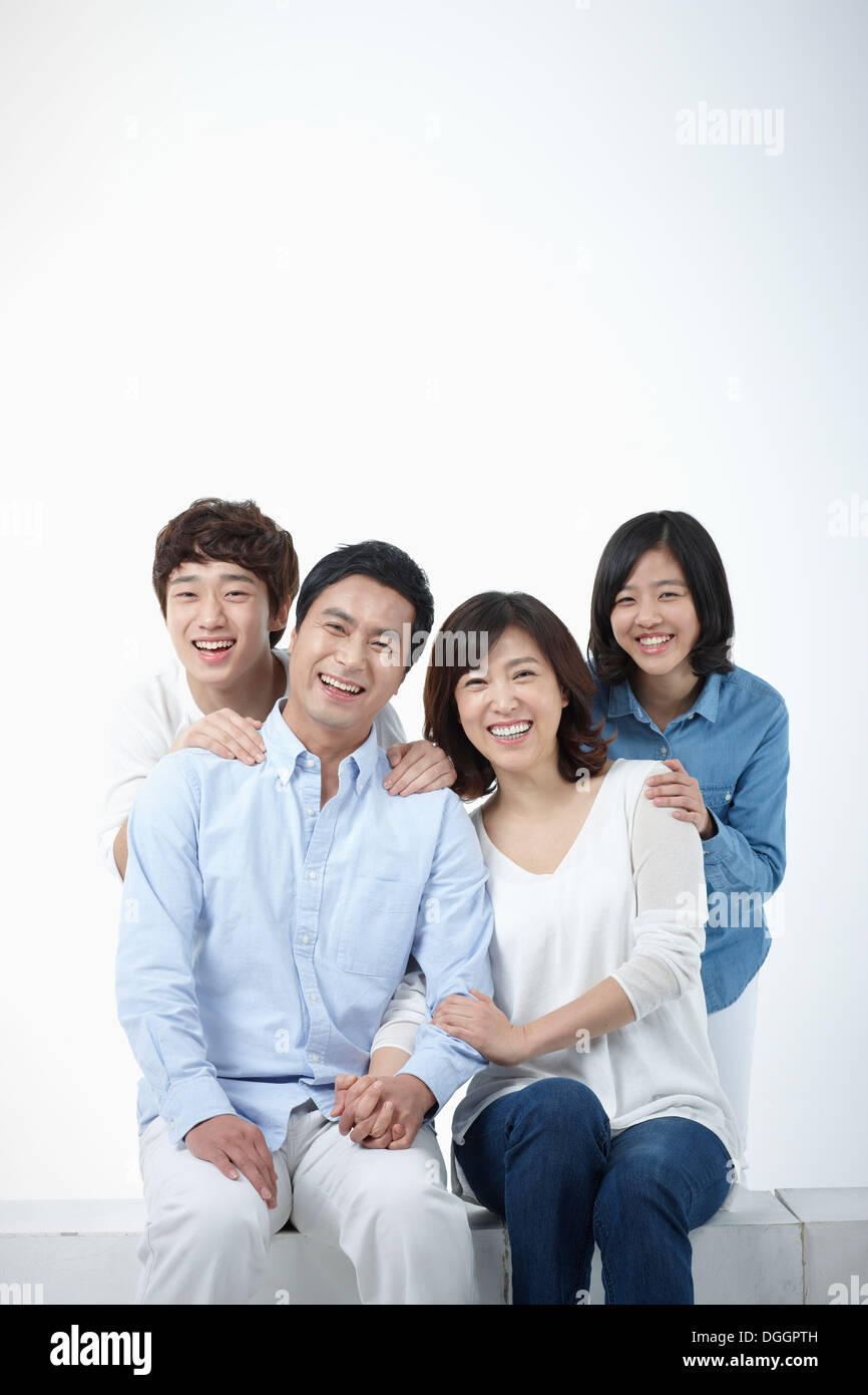 family sitting together Stock Photo - Alamy
