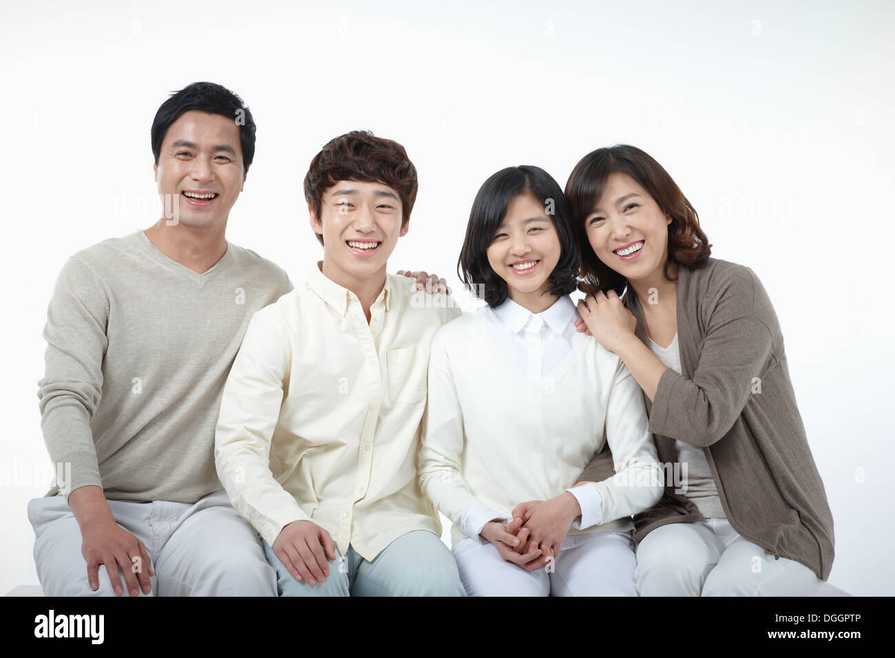 family sitting together Stock Photo - Alamy