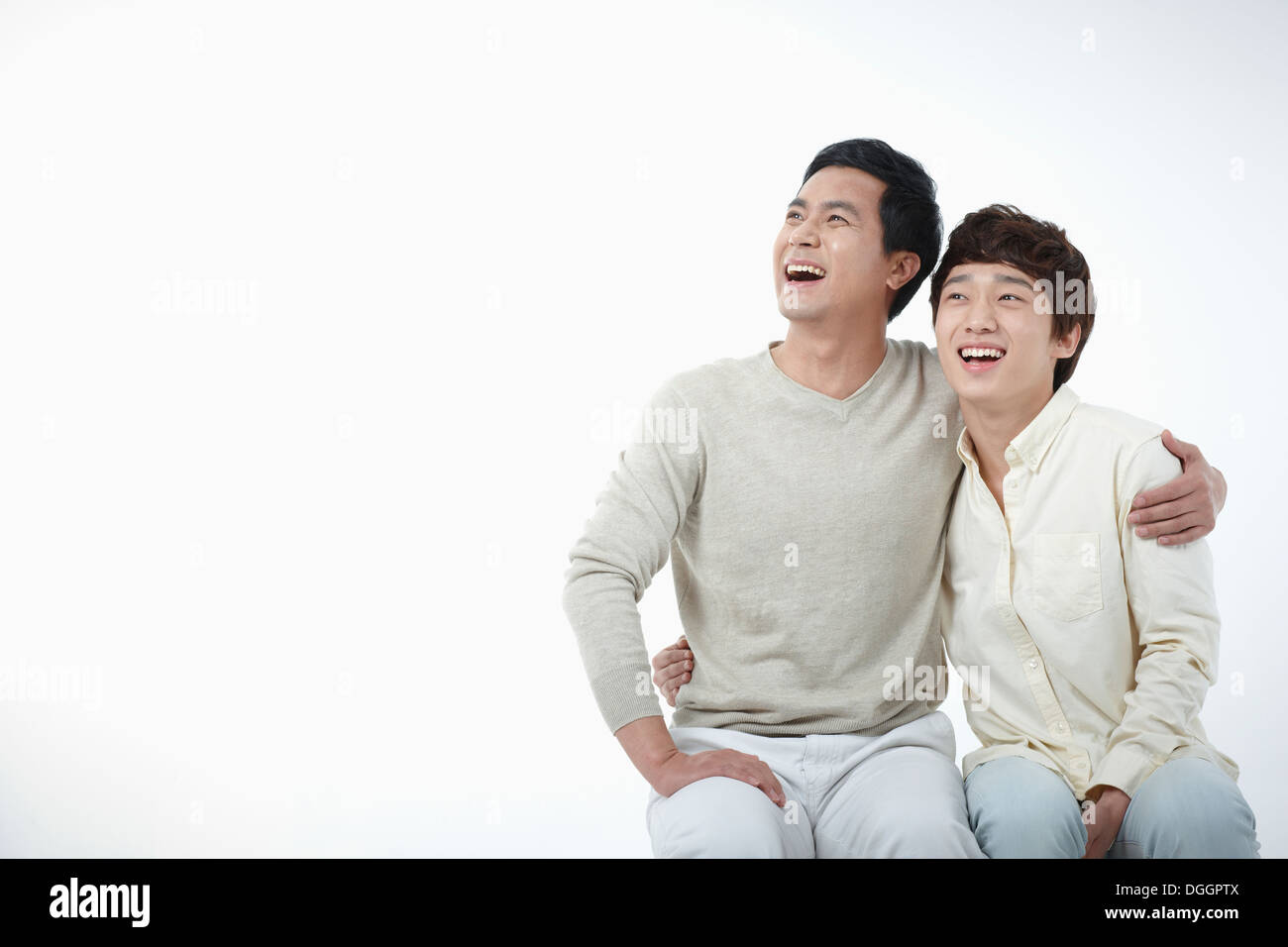 father sitting with son Stock Photo - Alamy