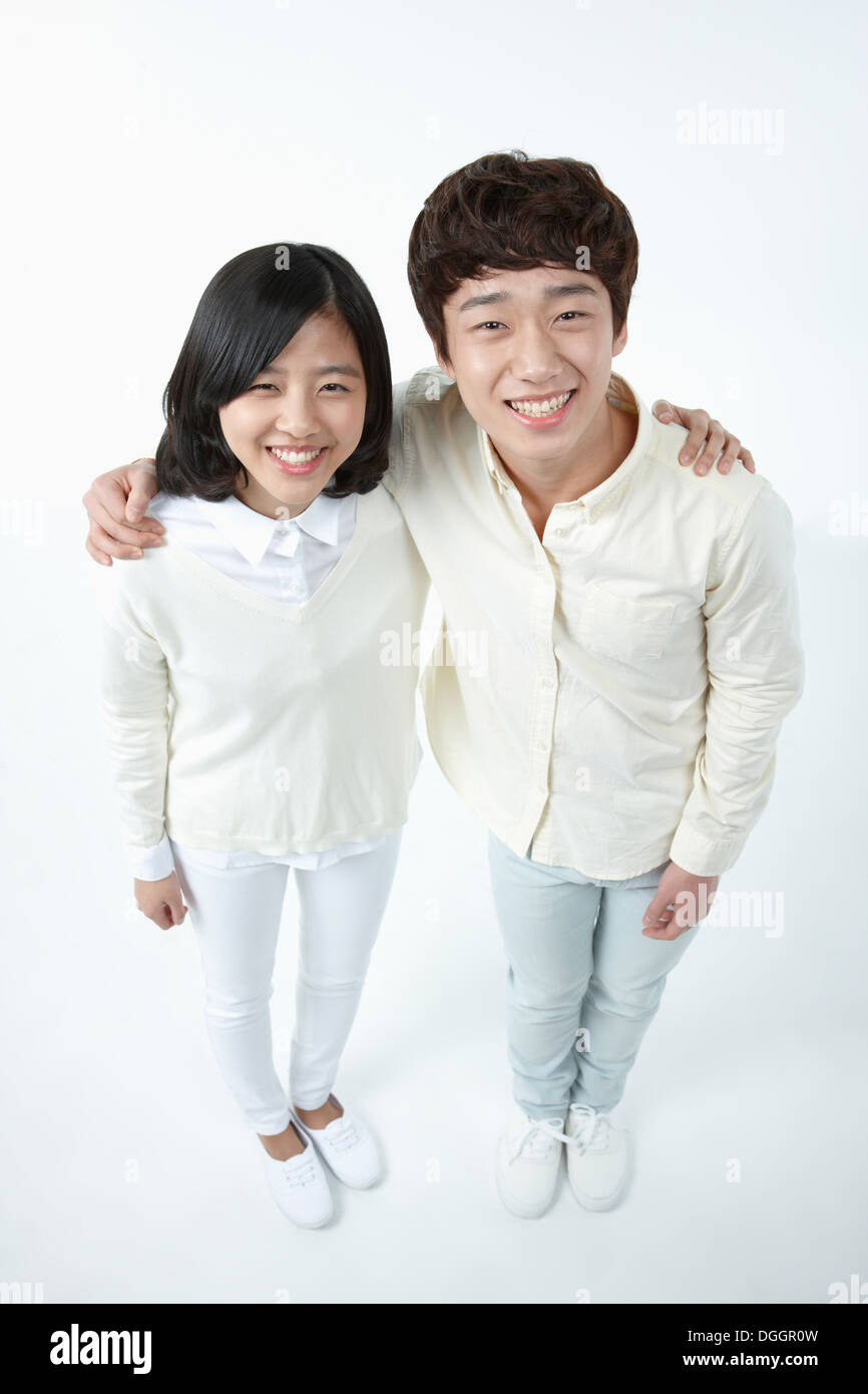 a brother standing with sister Stock Photo - Alamy