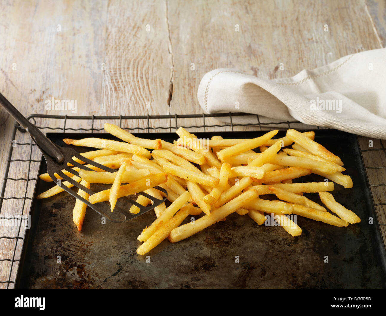 Frites on baking sheet Stock Photo - Alamy