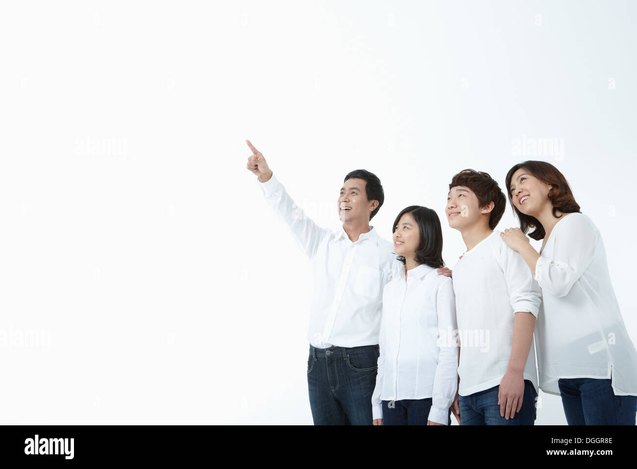 a family standing together Stock Photo - Alamy