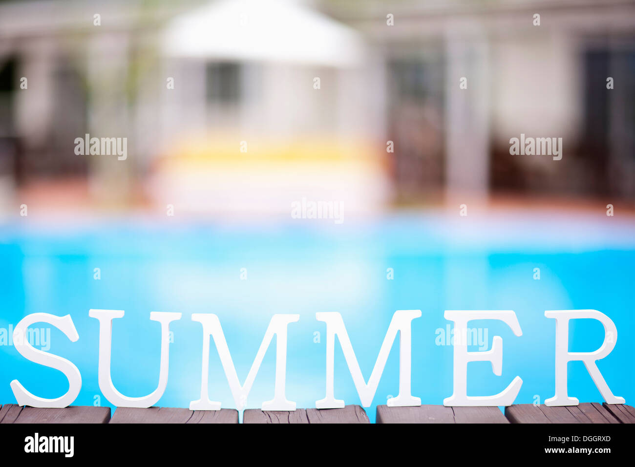 the word summer next to a pool Stock Photo - Alamy