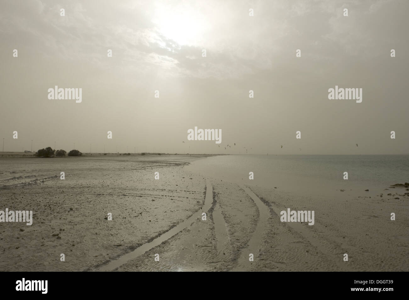 Sudden sandstorm developing over beach blotting out sun and catching ...