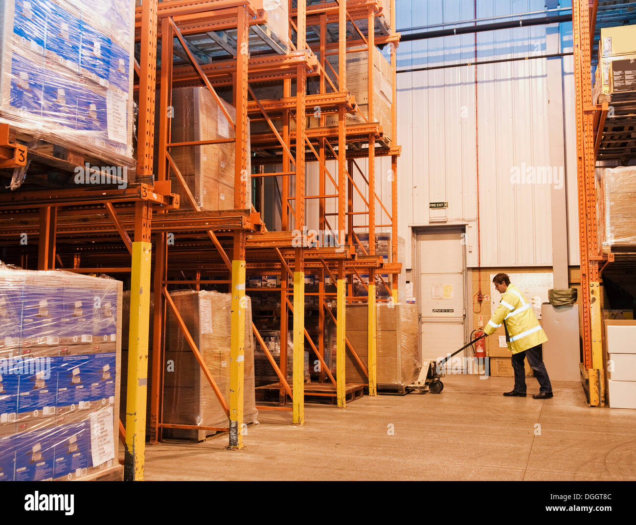 Man working in warehouse Stock Photo - Alamy