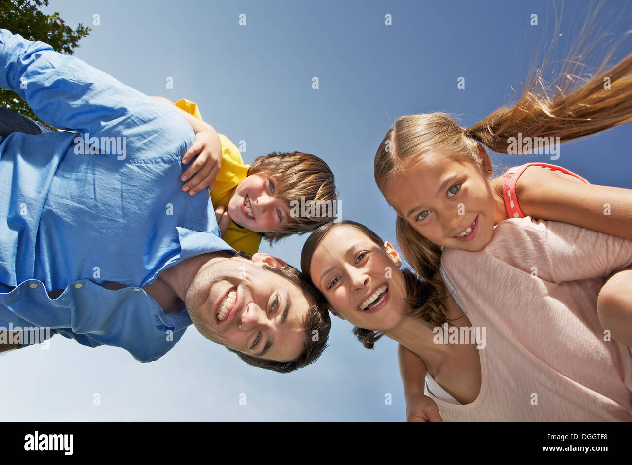 Portrait of family with two children from below Stock Photo - Alamy