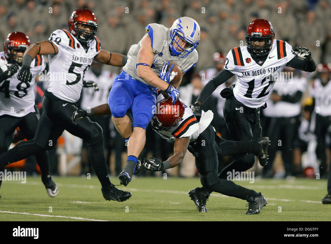Falcon running back Anthony LaCoste, a senior, goes airborne as Air ...